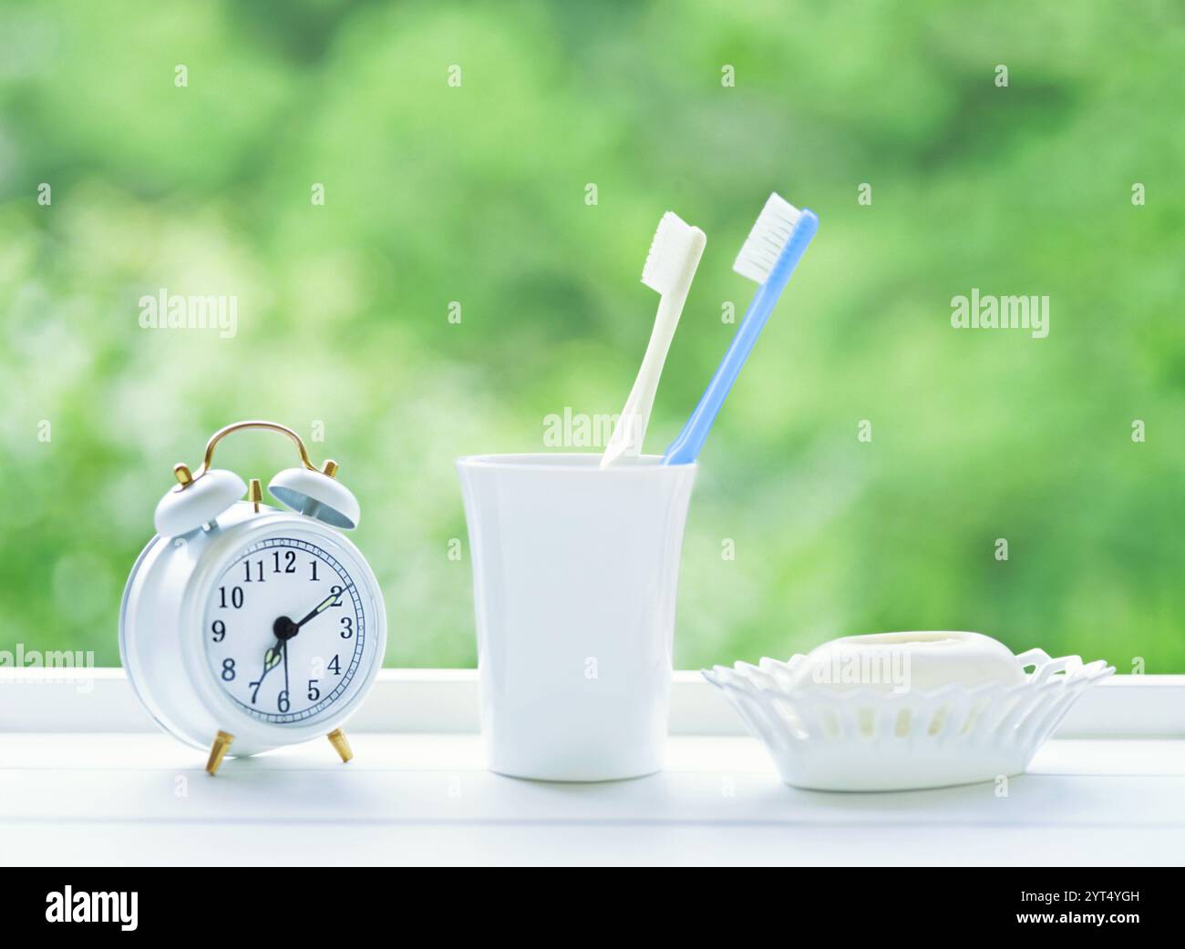 Toothbrush, clock and soap Stock Photo - Alamy