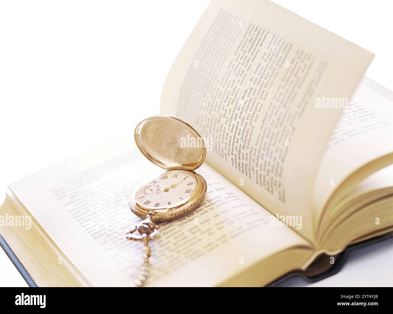 Book and pocket watch Stock Photo - Alamy