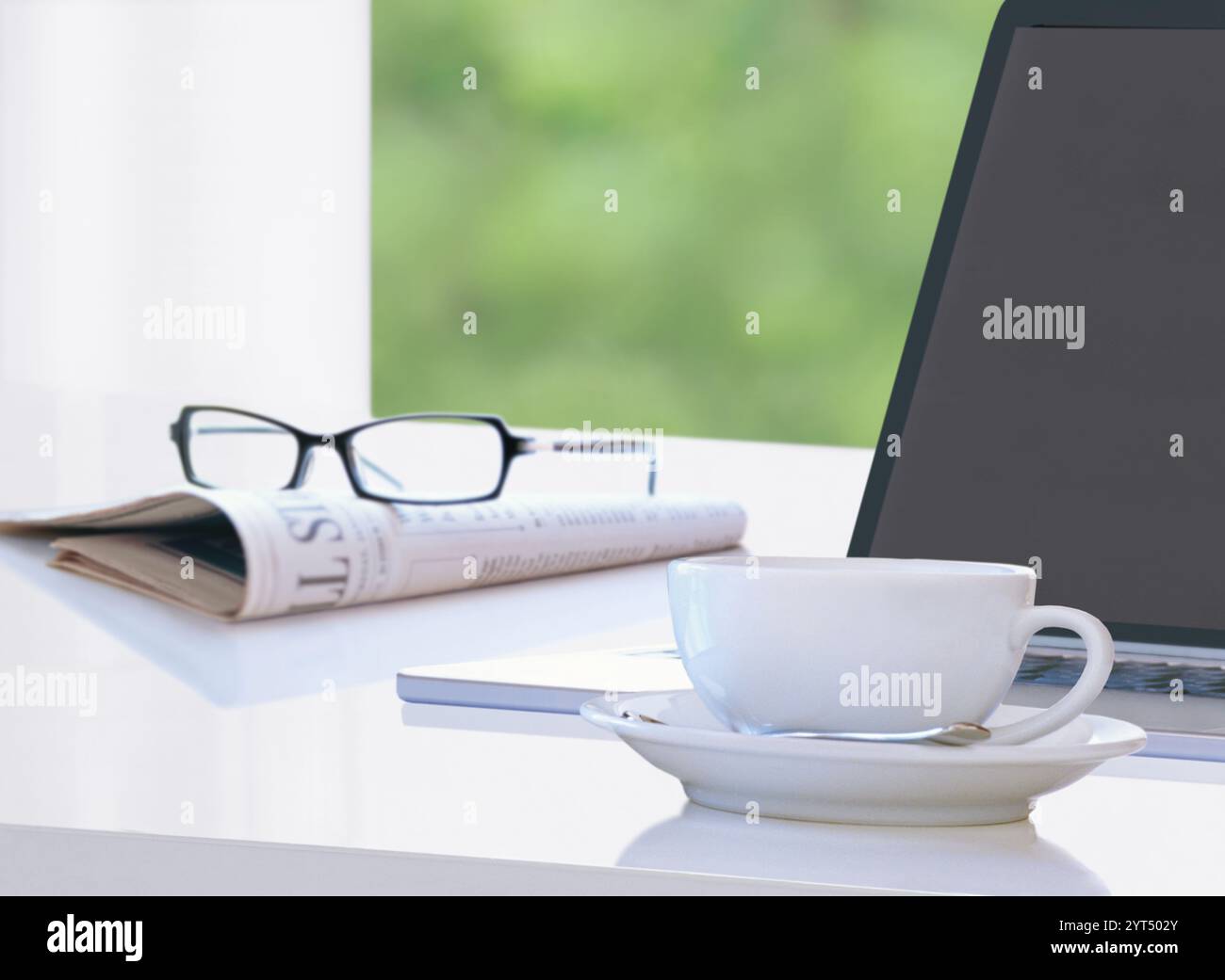 Computer, coffee cup and newspaper Stock Photo - Alamy