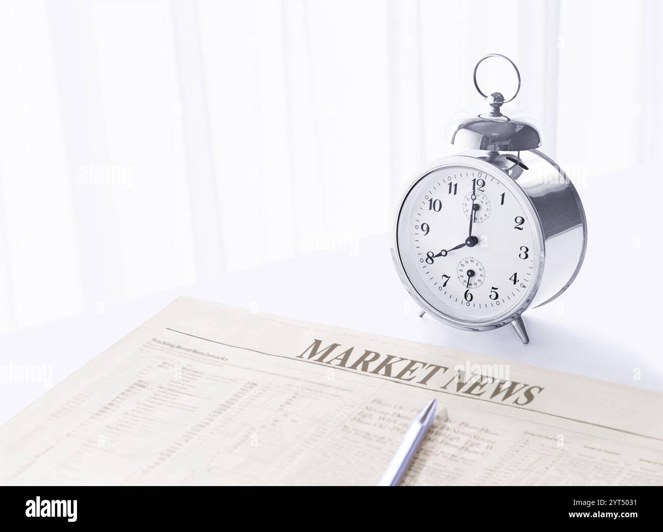 Alarm clock and newspaper on the windowsill Stock Photo - Alamy