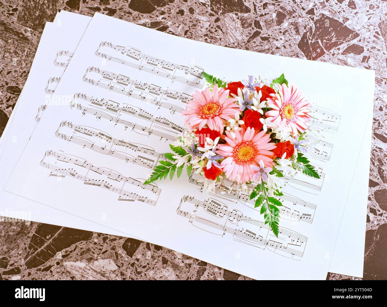 Sheet music and flower arrangement Stock Photo - Alamy