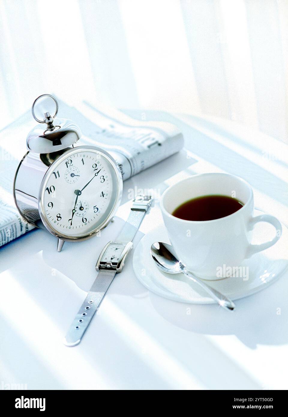 Alarm clock, newspaper and coffee Stock Photo - Alamy