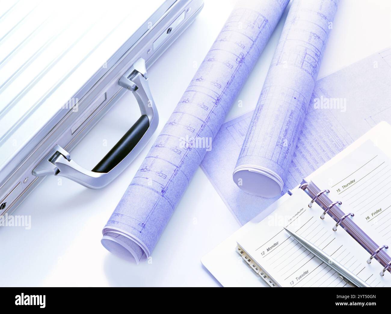 Blueprint and attache case Stock Photo - Alamy