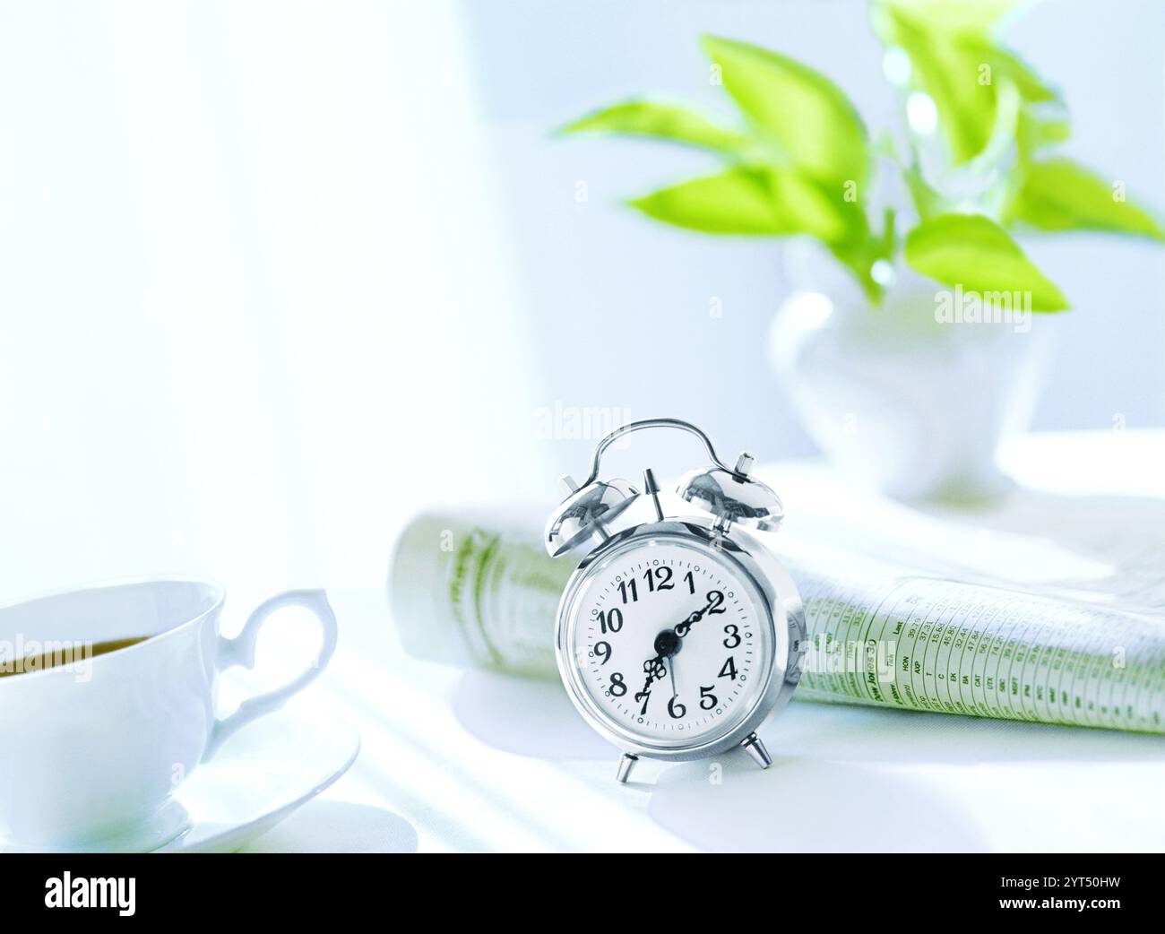 Alarm clock, newspaper and coffee Stock Photo - Alamy