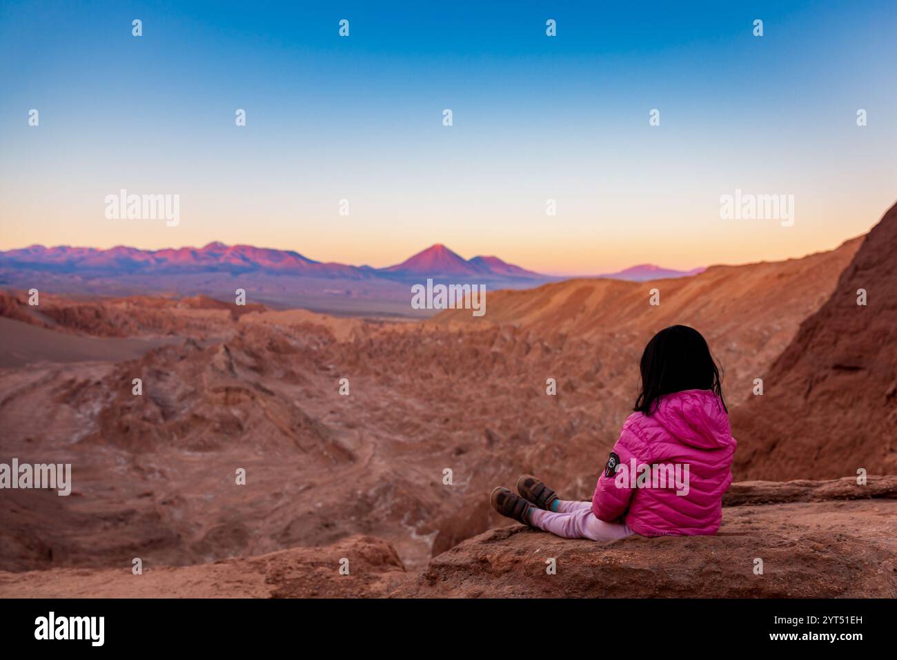 A little girl gazes at the surreal landscape of the Atacama Desert in ...