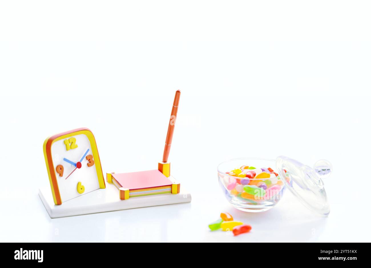 Clock and sweets Stock Photo - Alamy