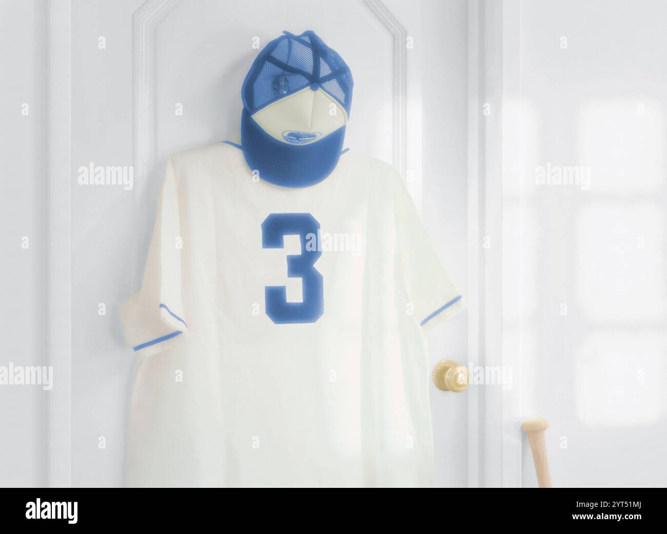 Baseball uniform on door Stock Photo - Alamy