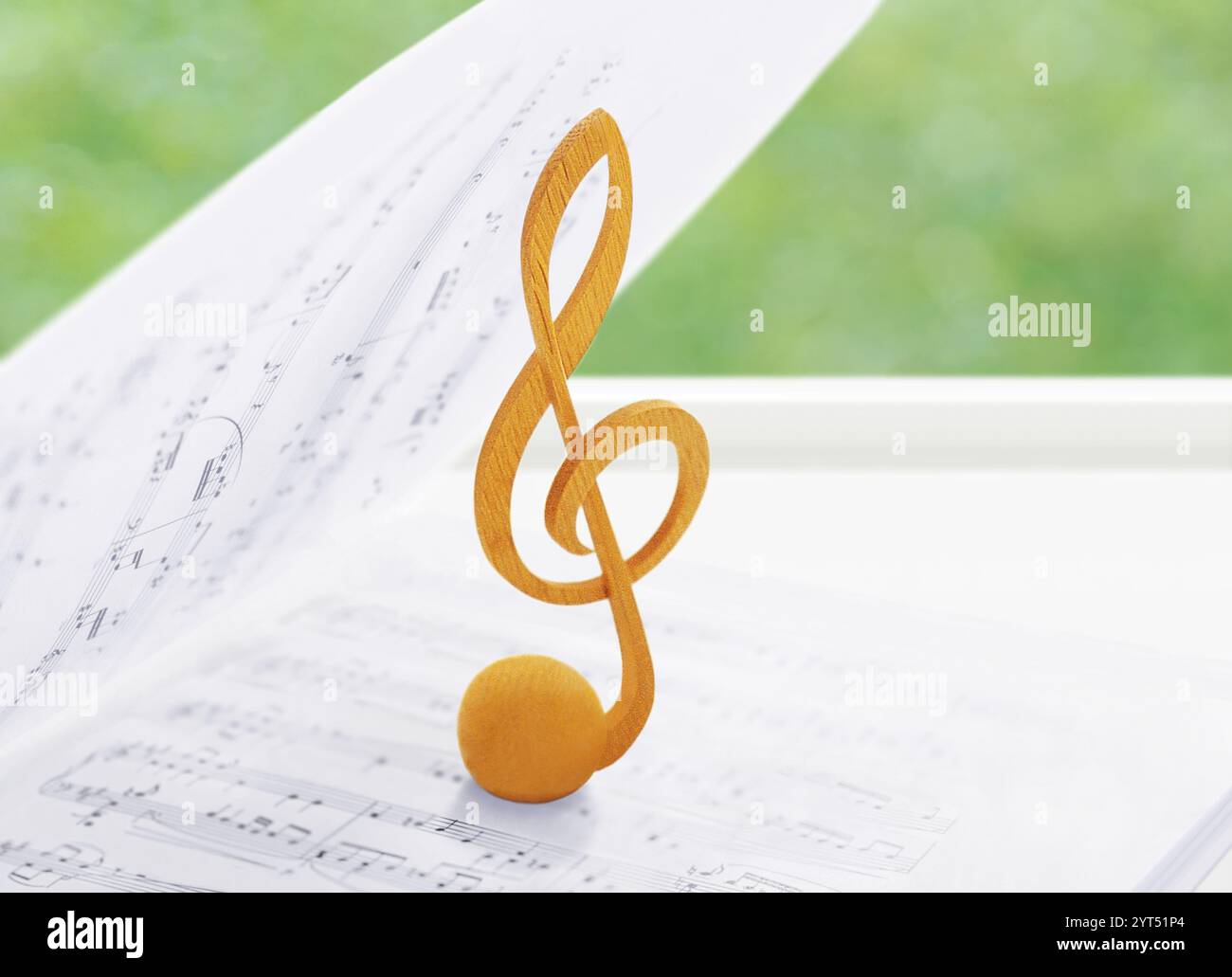 G clef and sheet music Stock Photo - Alamy
