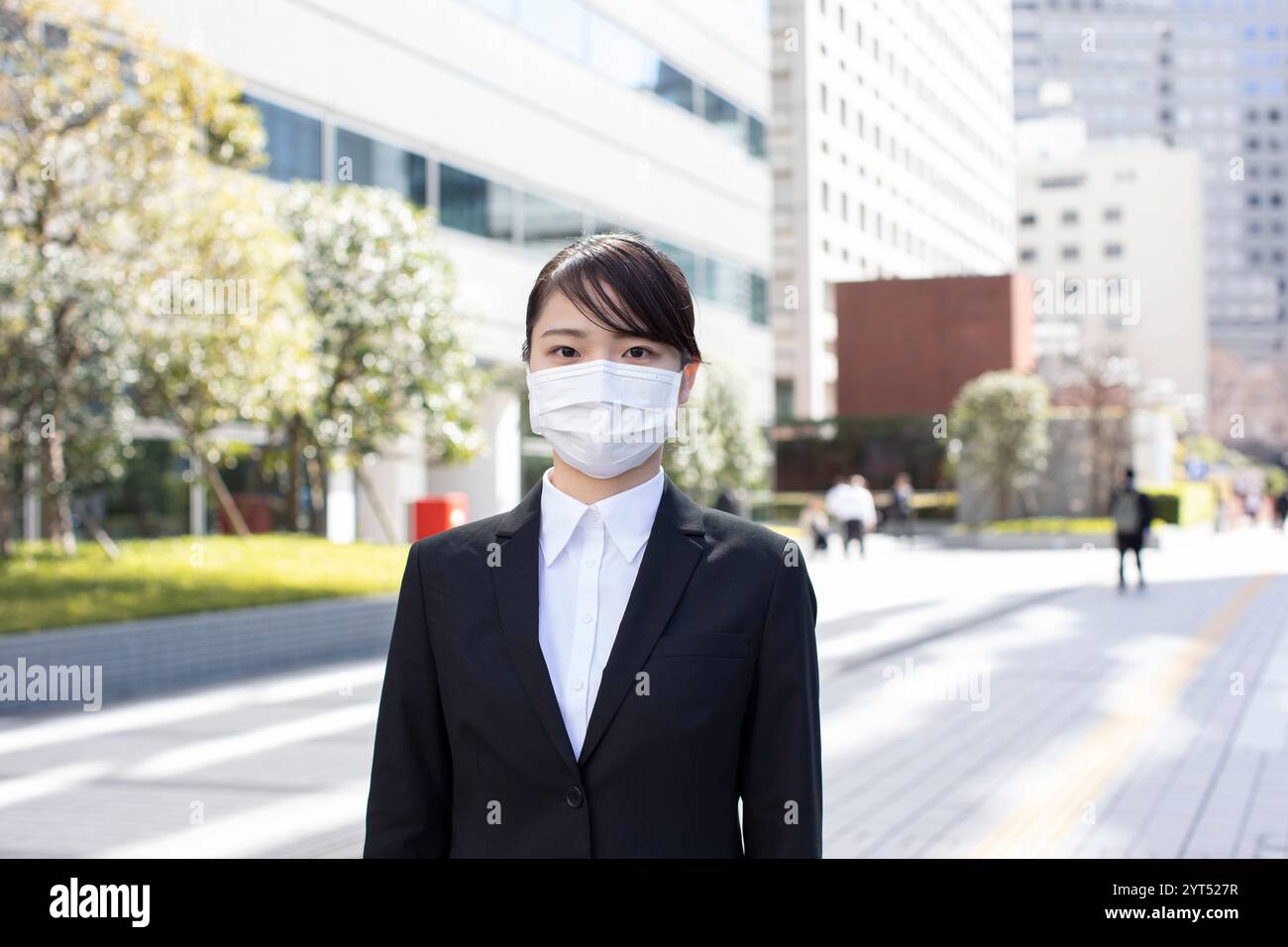 Young businesswoman wearing medical mask hi-res stock photography and ...