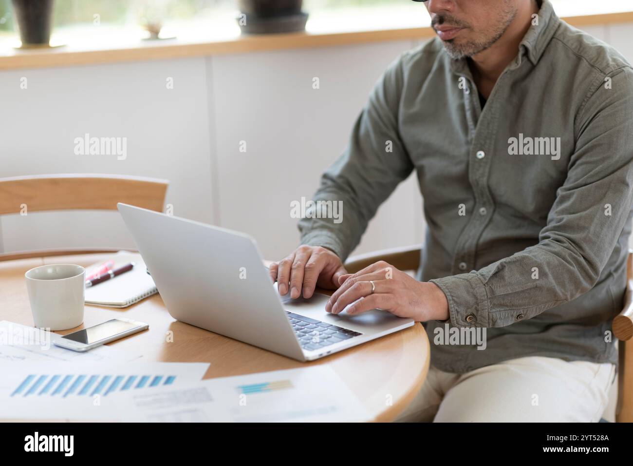 Man and computer and wedding ring hi-res stock photography and images ...
