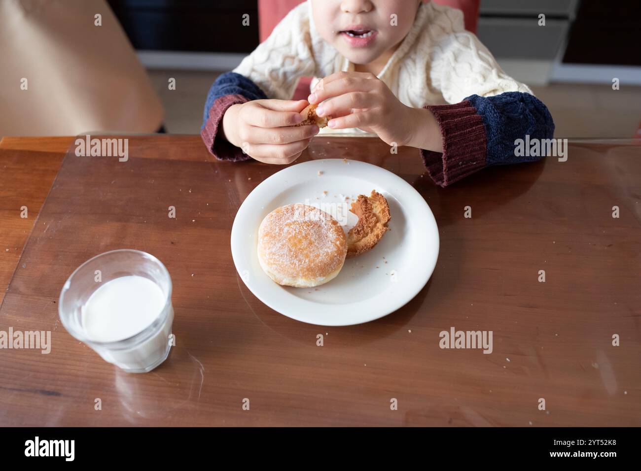 Boy eating snack Stock Photo - Alamy