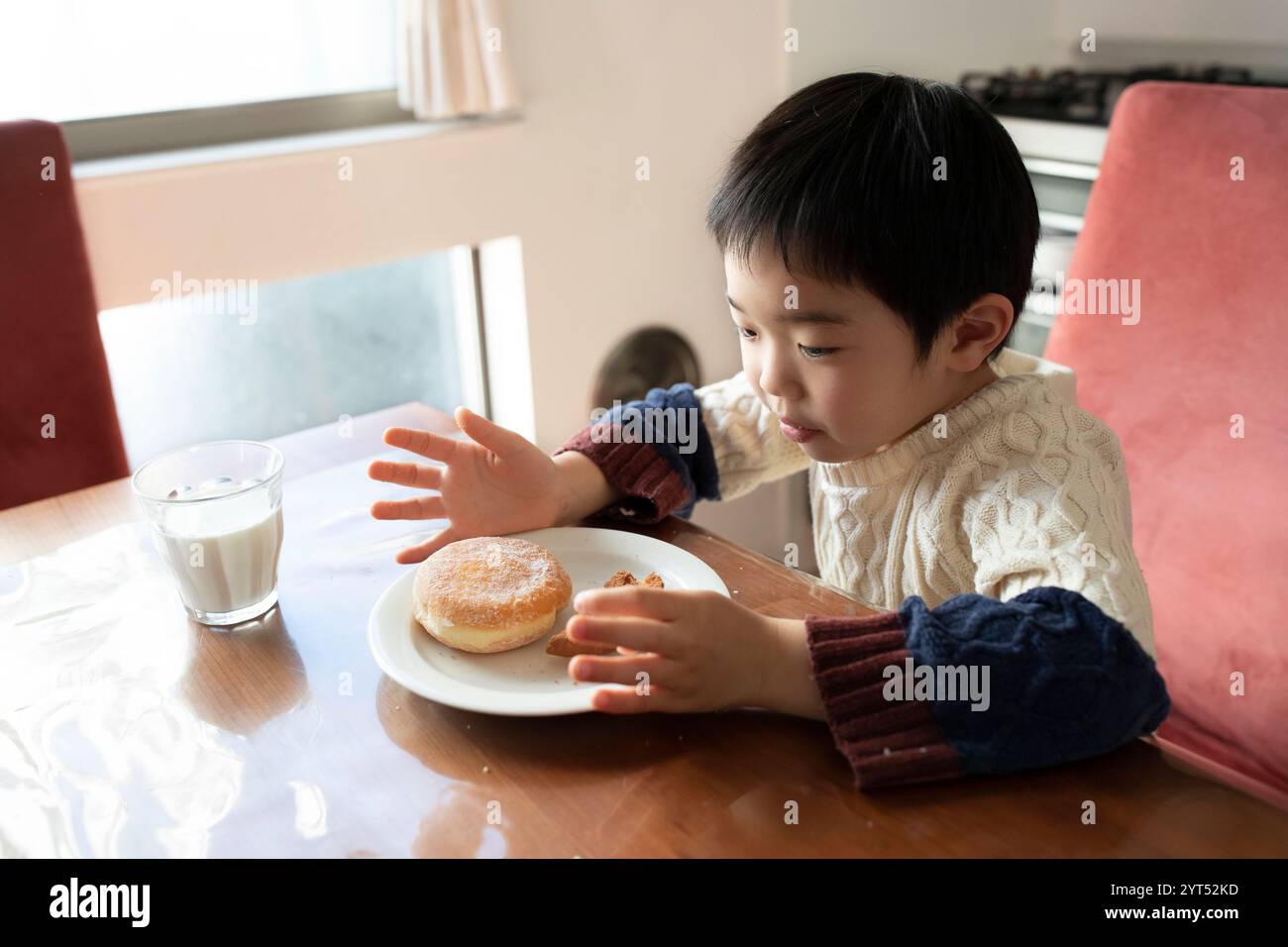 Boy eating snack Stock Photo - Alamy