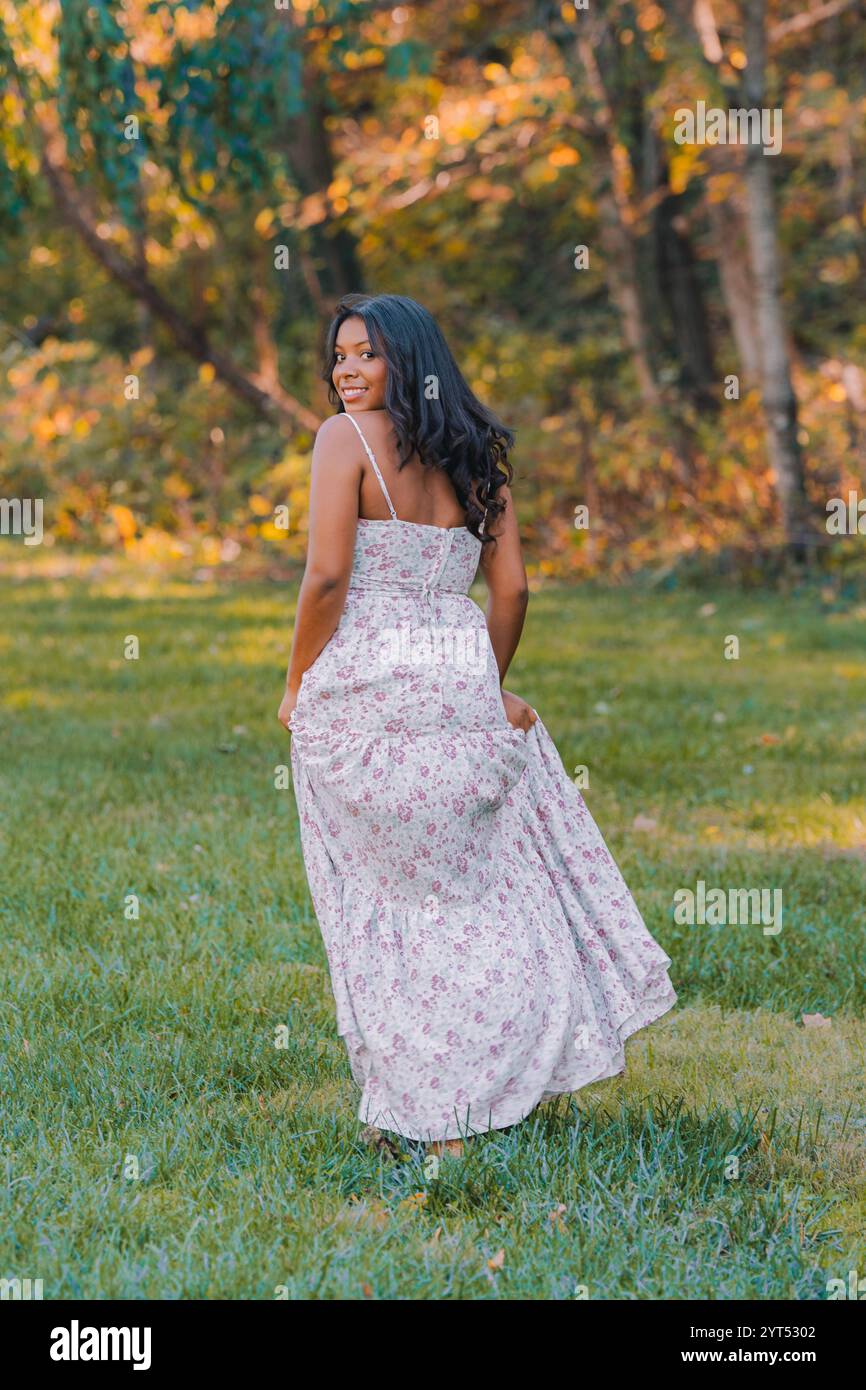 Portrait of a african american young lady walking away Stock Photo - Alamy