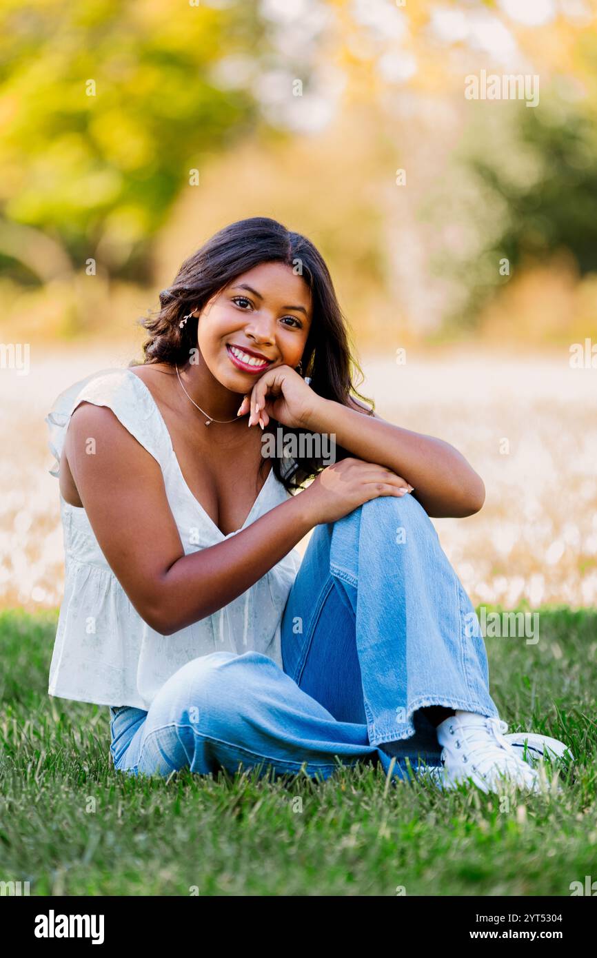 Casual portrait of a model sitting down Stock Photo - Alamy