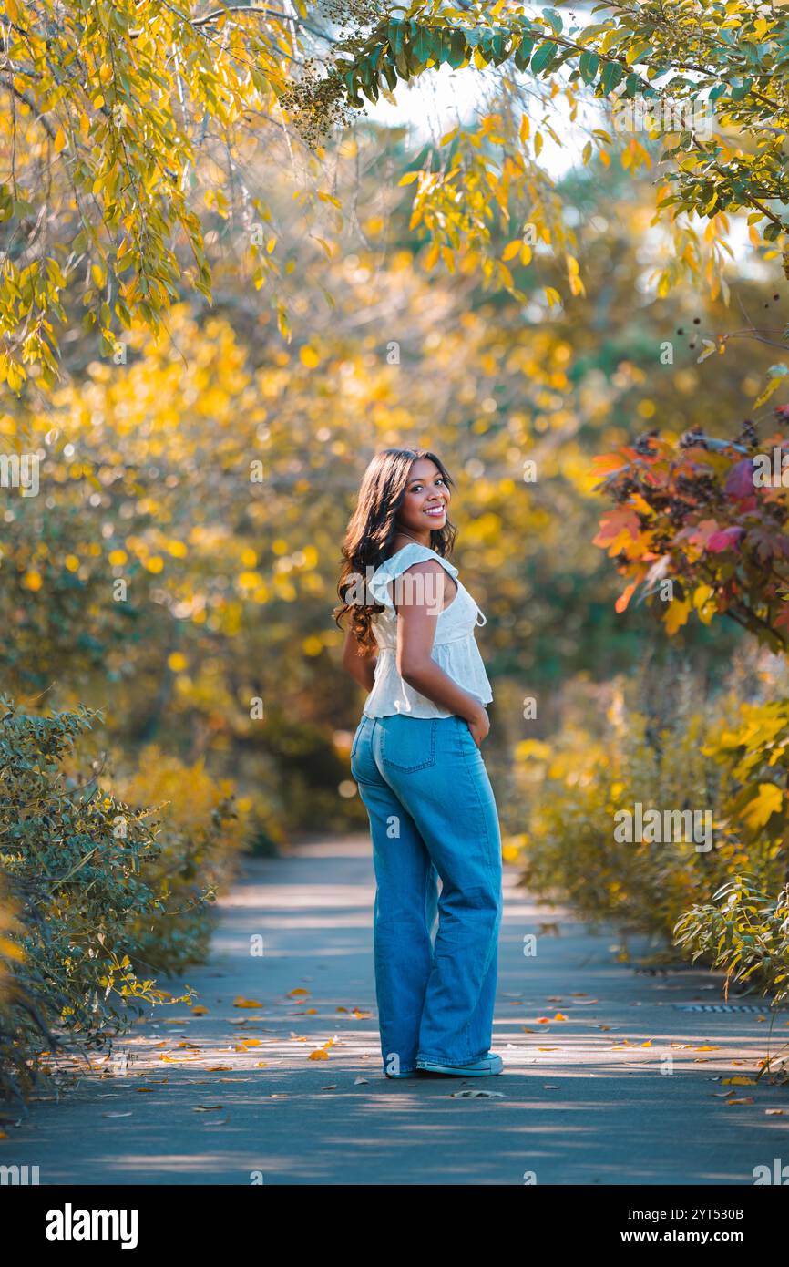 Model posing under a canopy of trees Stock Photo - Alamy