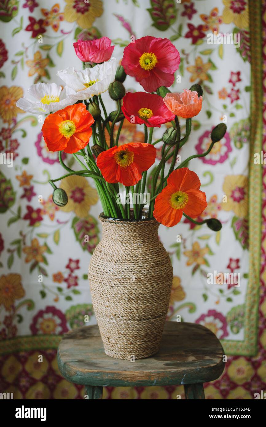 Poppies in a rustic vase Stock Photo - Alamy