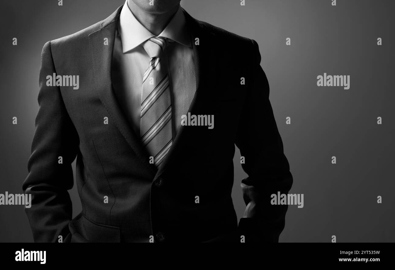 Businessman posing in front Stock Photo - Alamy