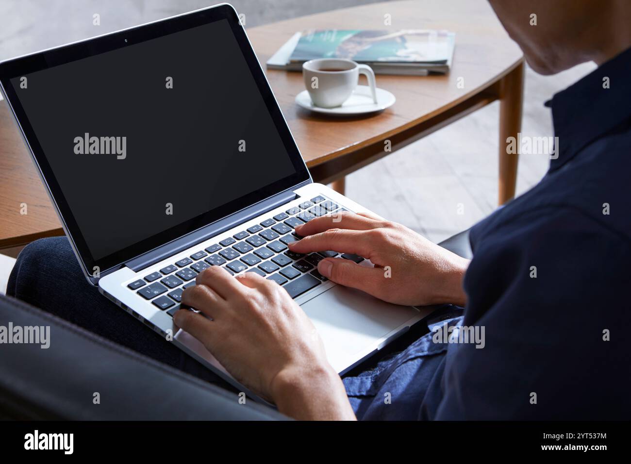 Man operating laptop Stock Photo - Alamy
