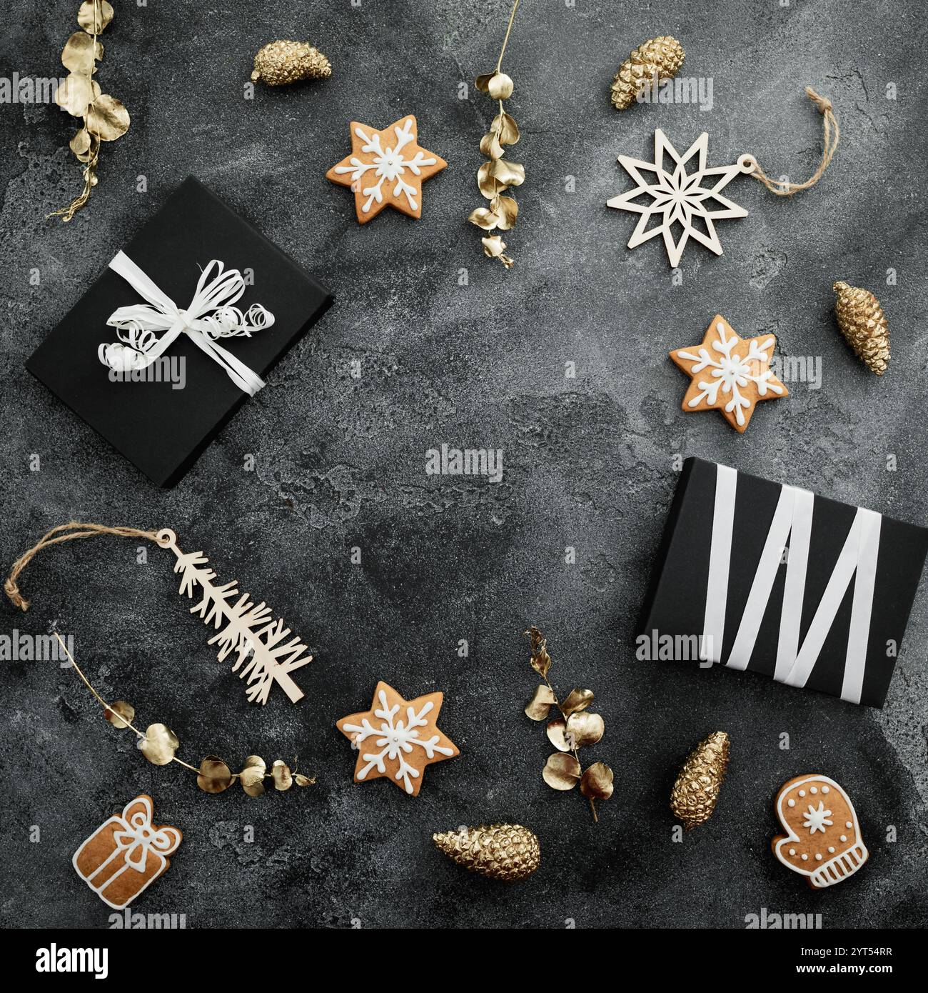 Holiday still life with Christmas gifts, cookies and golden decoration ...