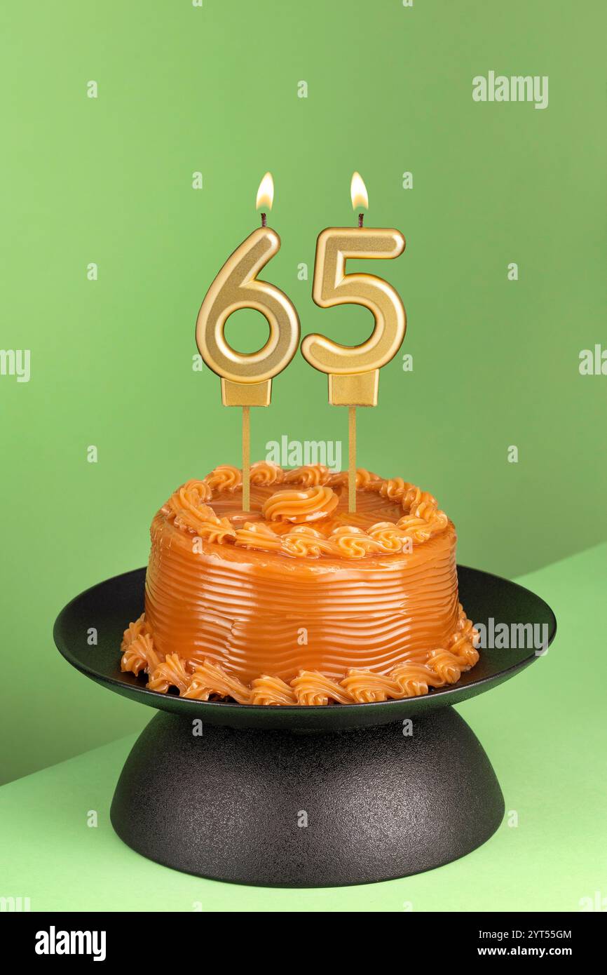 Number 65 birthday candle on a green background - Delicious cake with ...