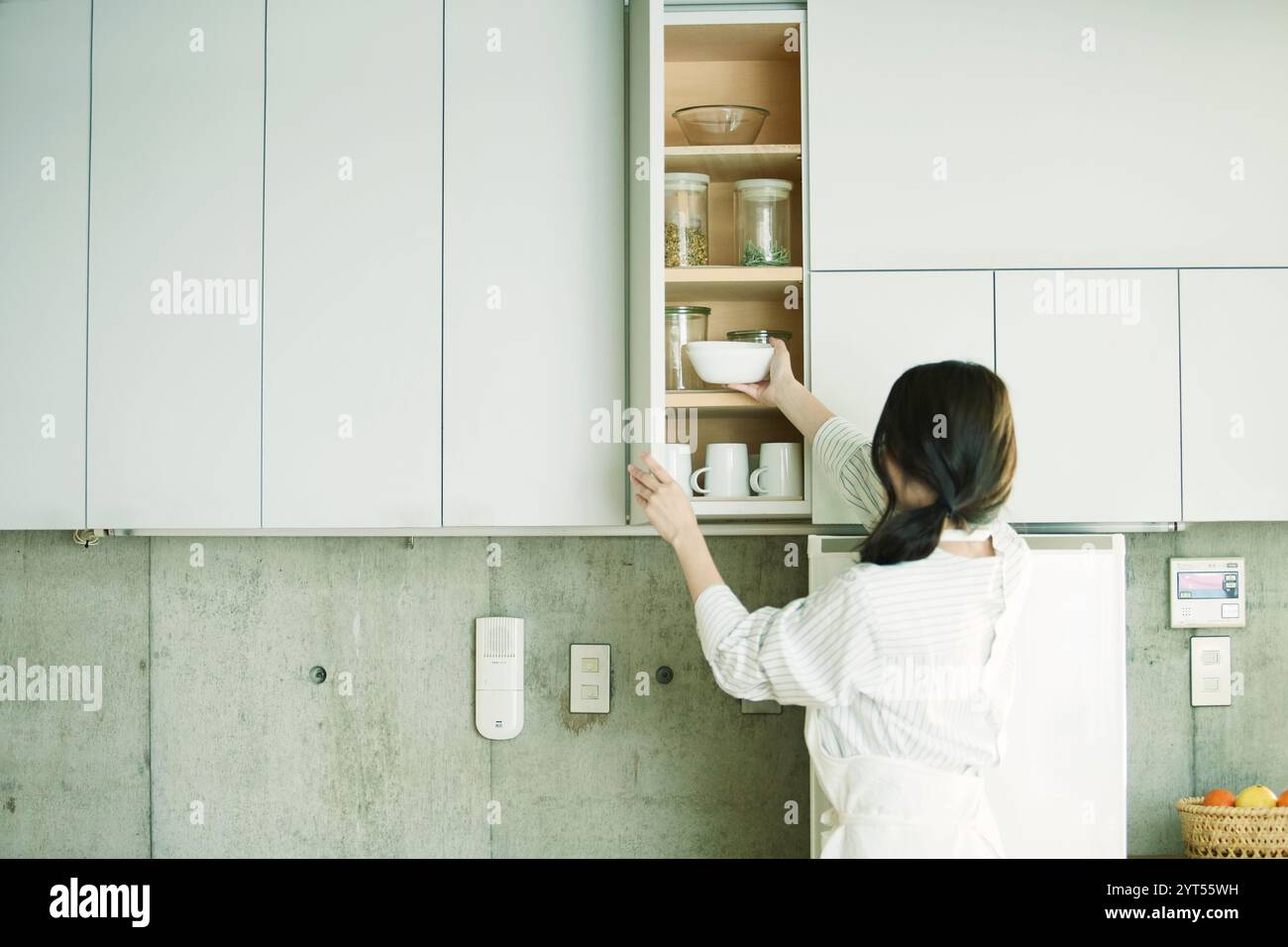 Woman in apron opening hi-res stock photography and images - Alamy