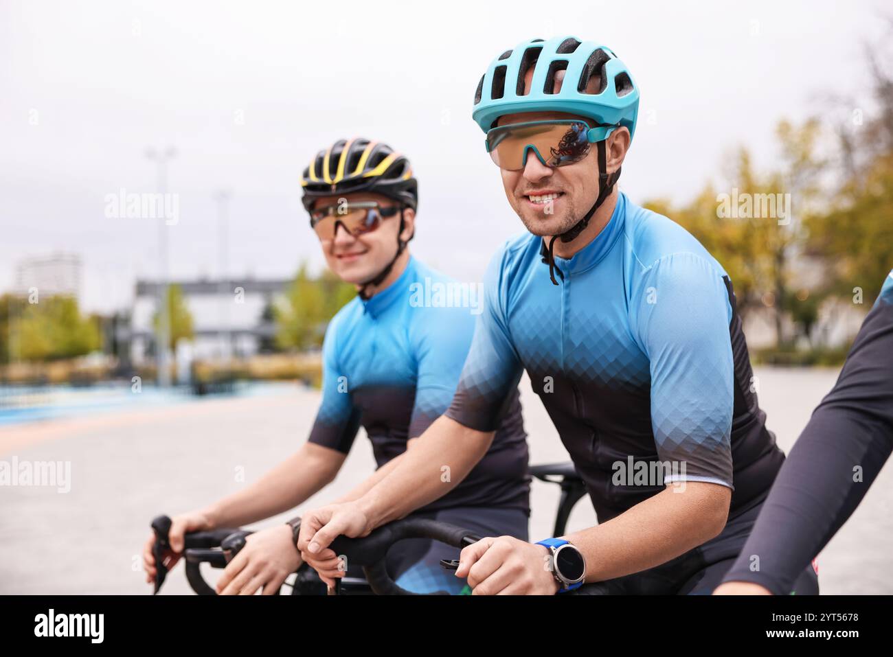 Group of athletic people with bicycles outdoors Stock Photo - Alamy