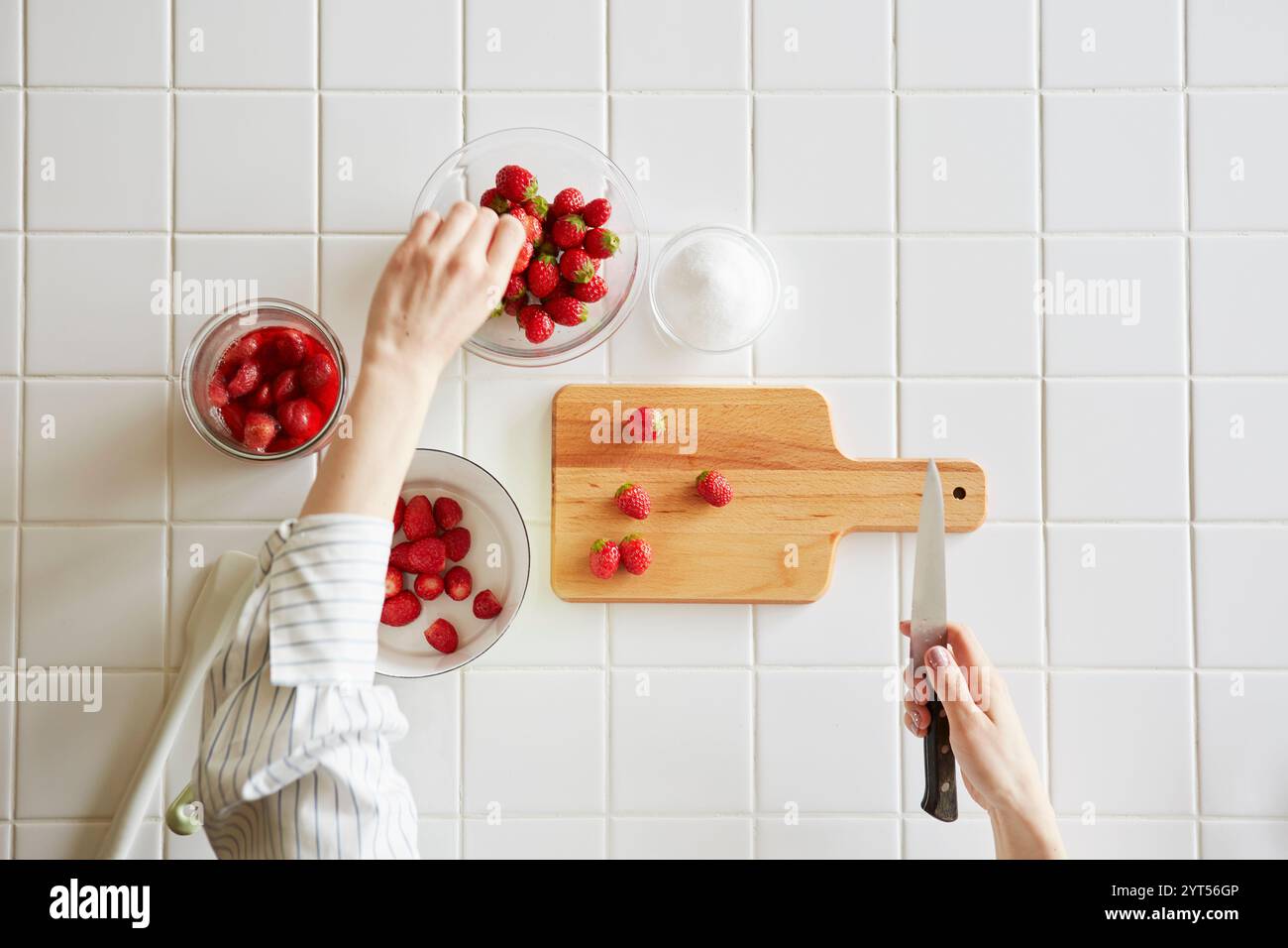 Woman making strawberry jam in kitchen Stock Photo - Alamy