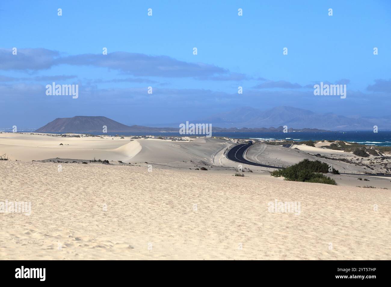 Scenic Desert Road with Mountain and Ocean Views against Lanzarotte ...