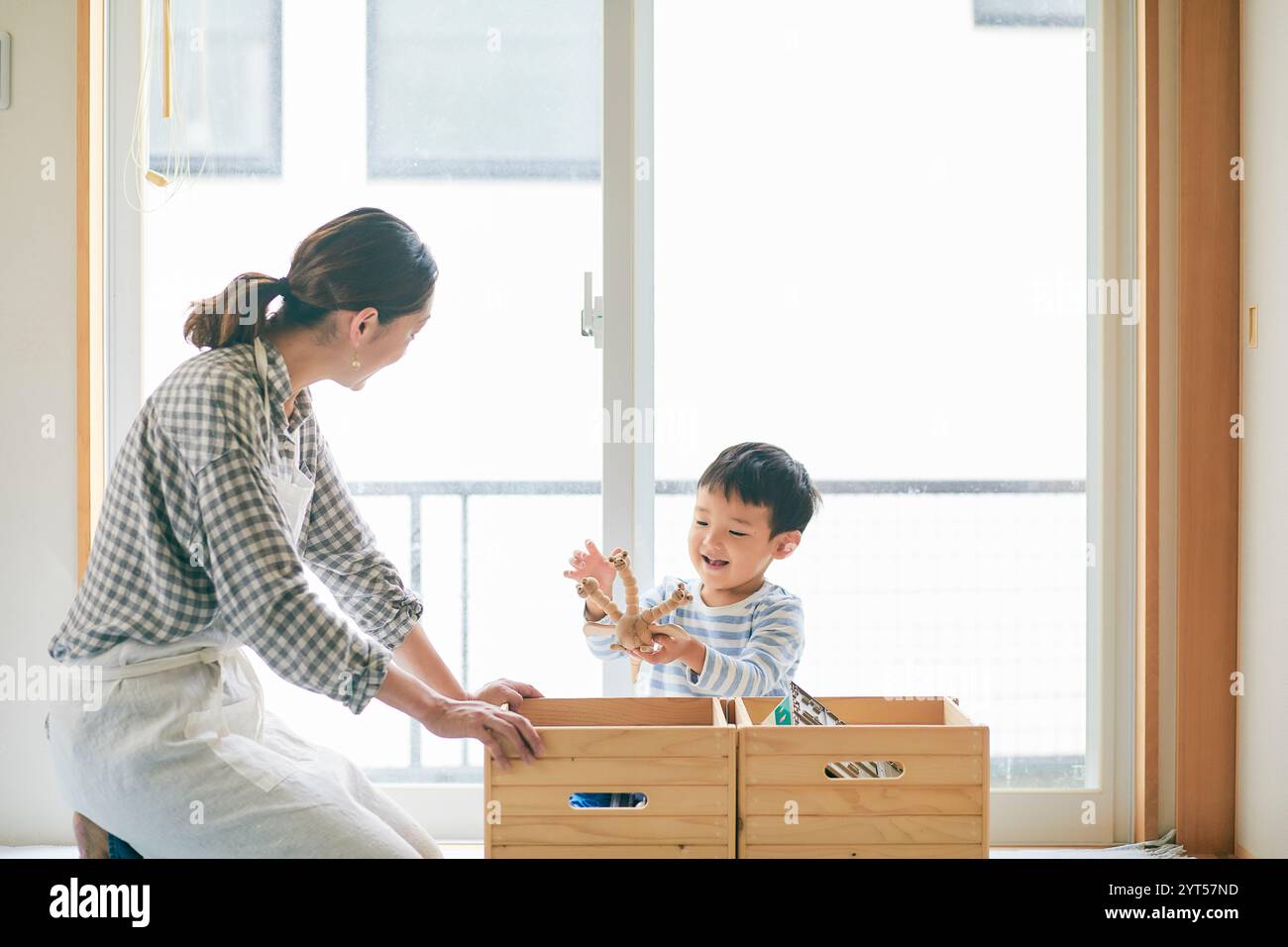 Woman with toy boy hi-res stock photography and images - Alamy