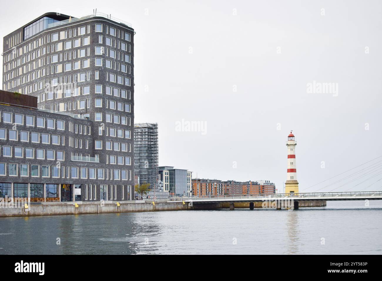 Malmo University building reflected in water Stock Photo - Alamy