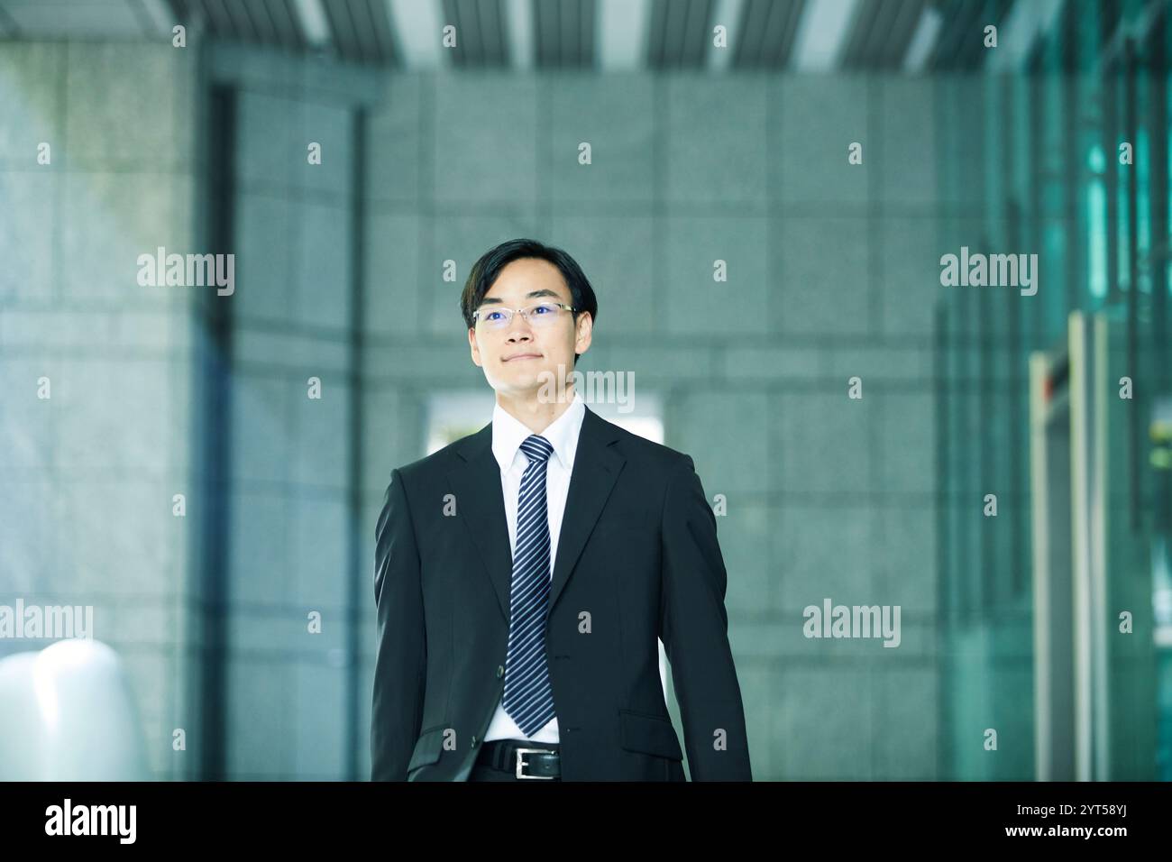 Businessmen walking in an office block Stock Photo - Alamy