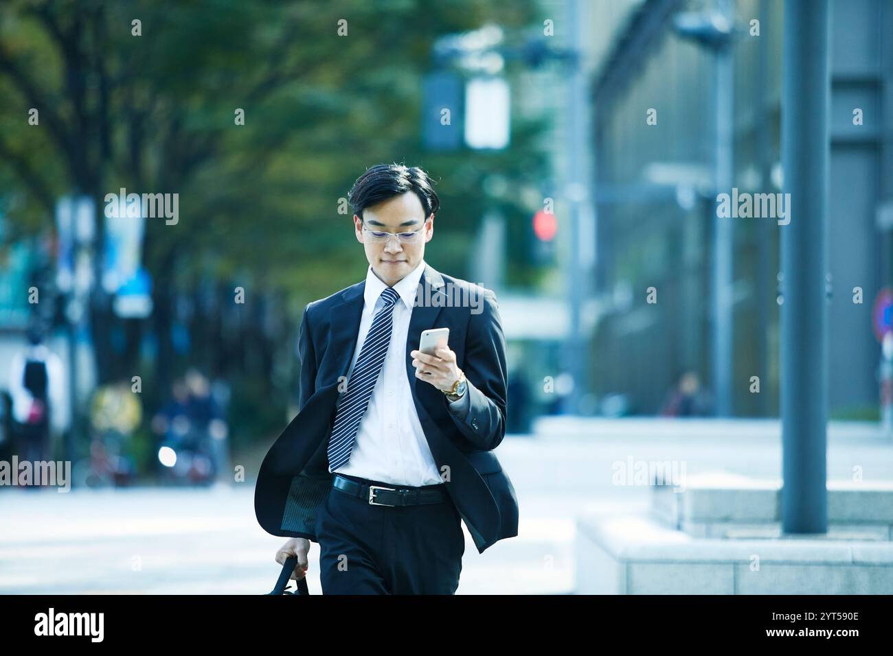 Businessmen walking in an office block Stock Photo - Alamy