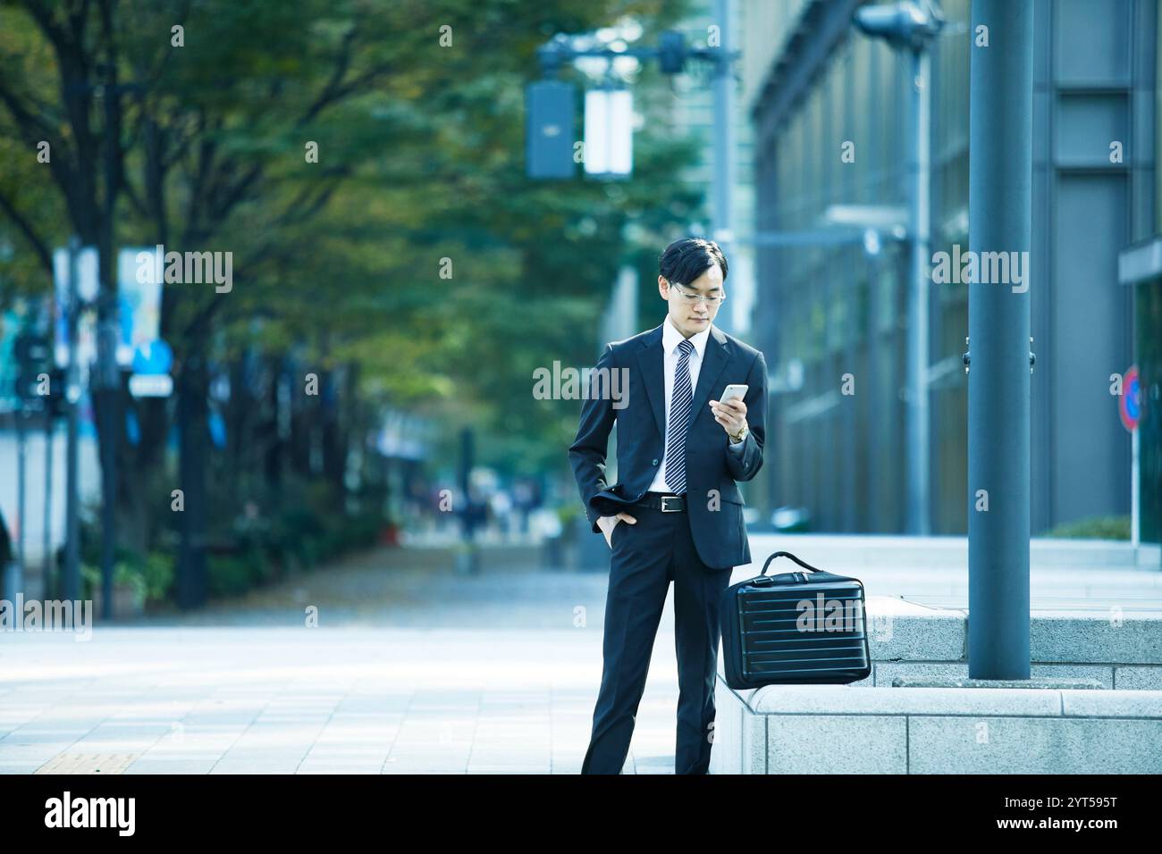 Businessmen walking in an office block Stock Photo - Alamy
