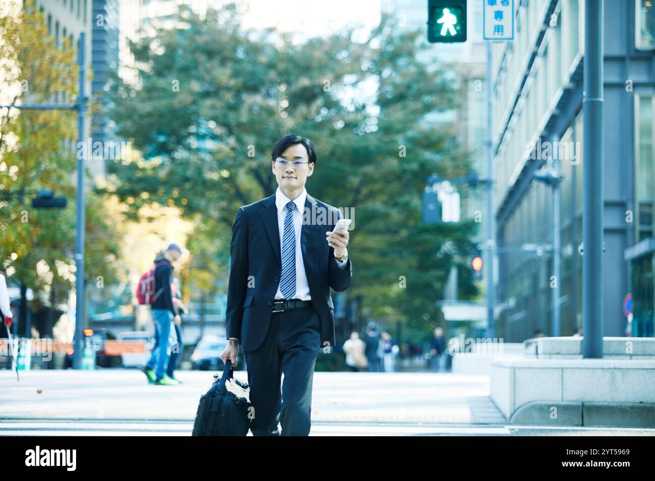 Businessmen walking in an office block Stock Photo - Alamy