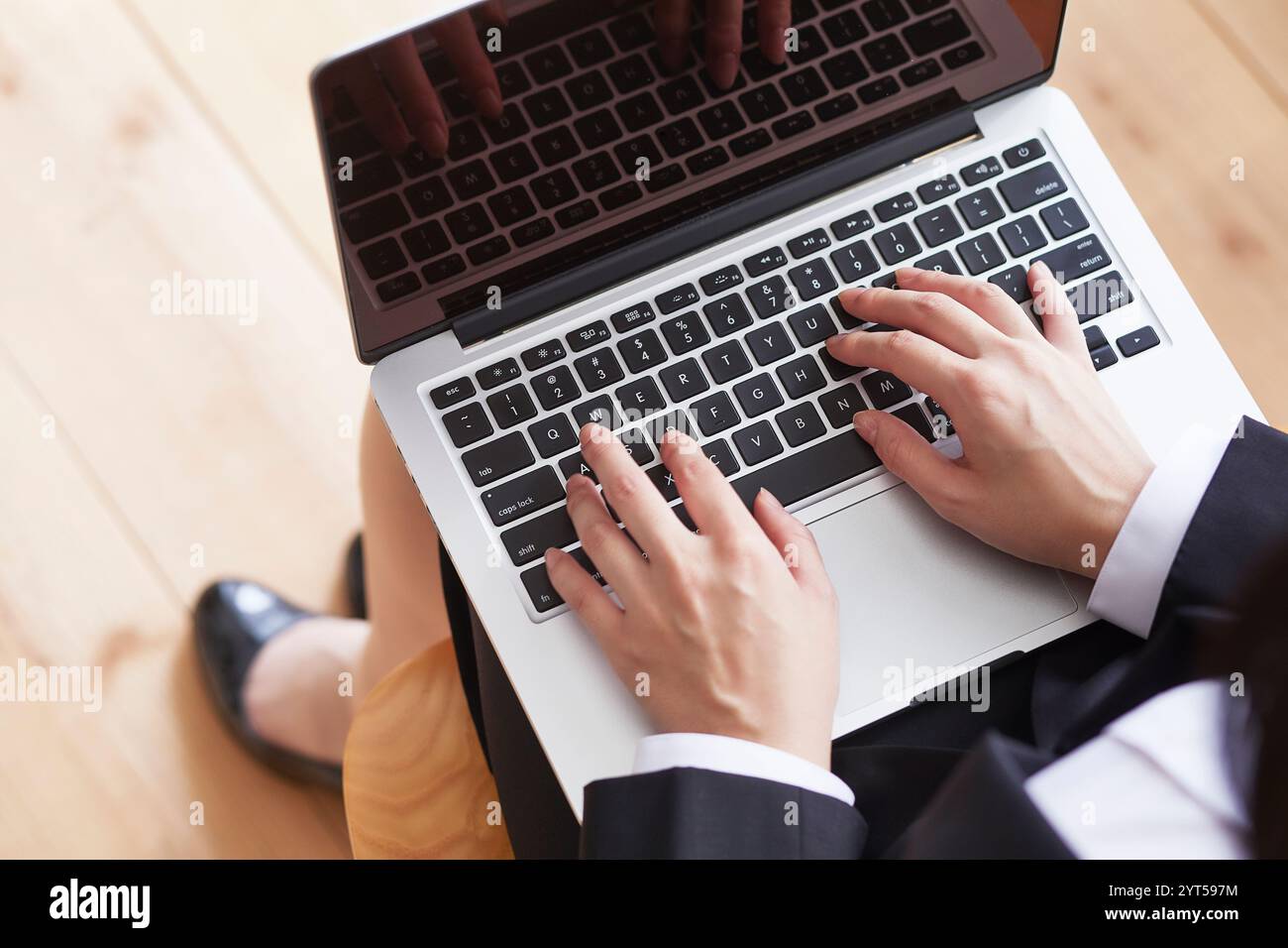 Computer and woman's hand Stock Photo - Alamy