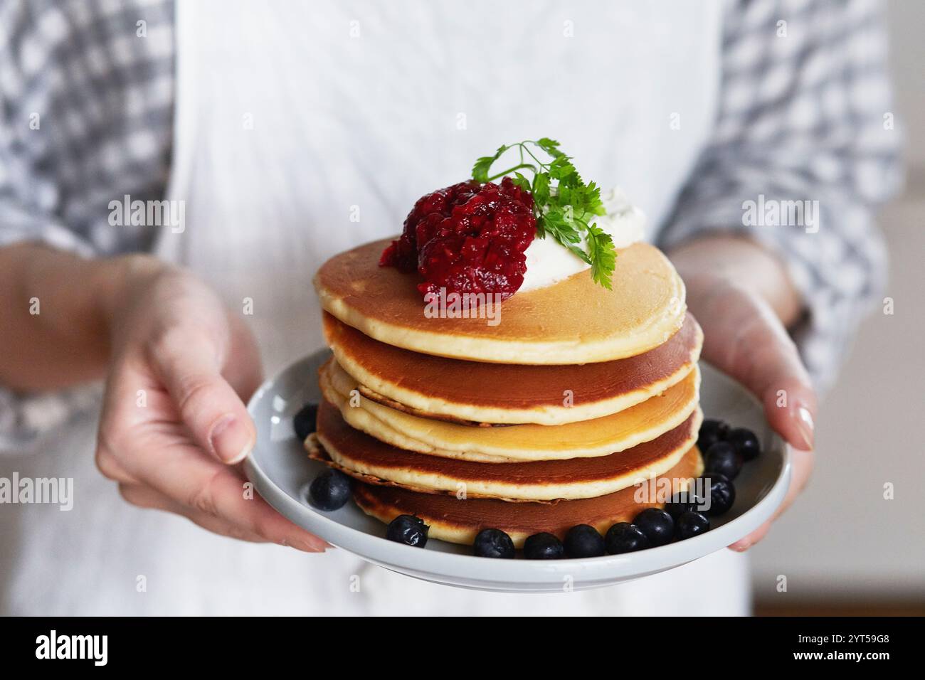 Woman holding pancake Stock Photo - Alamy