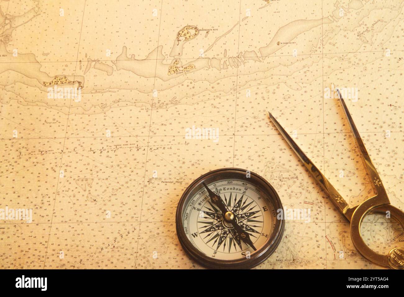 Old map, compass and divider Stock Photo - Alamy