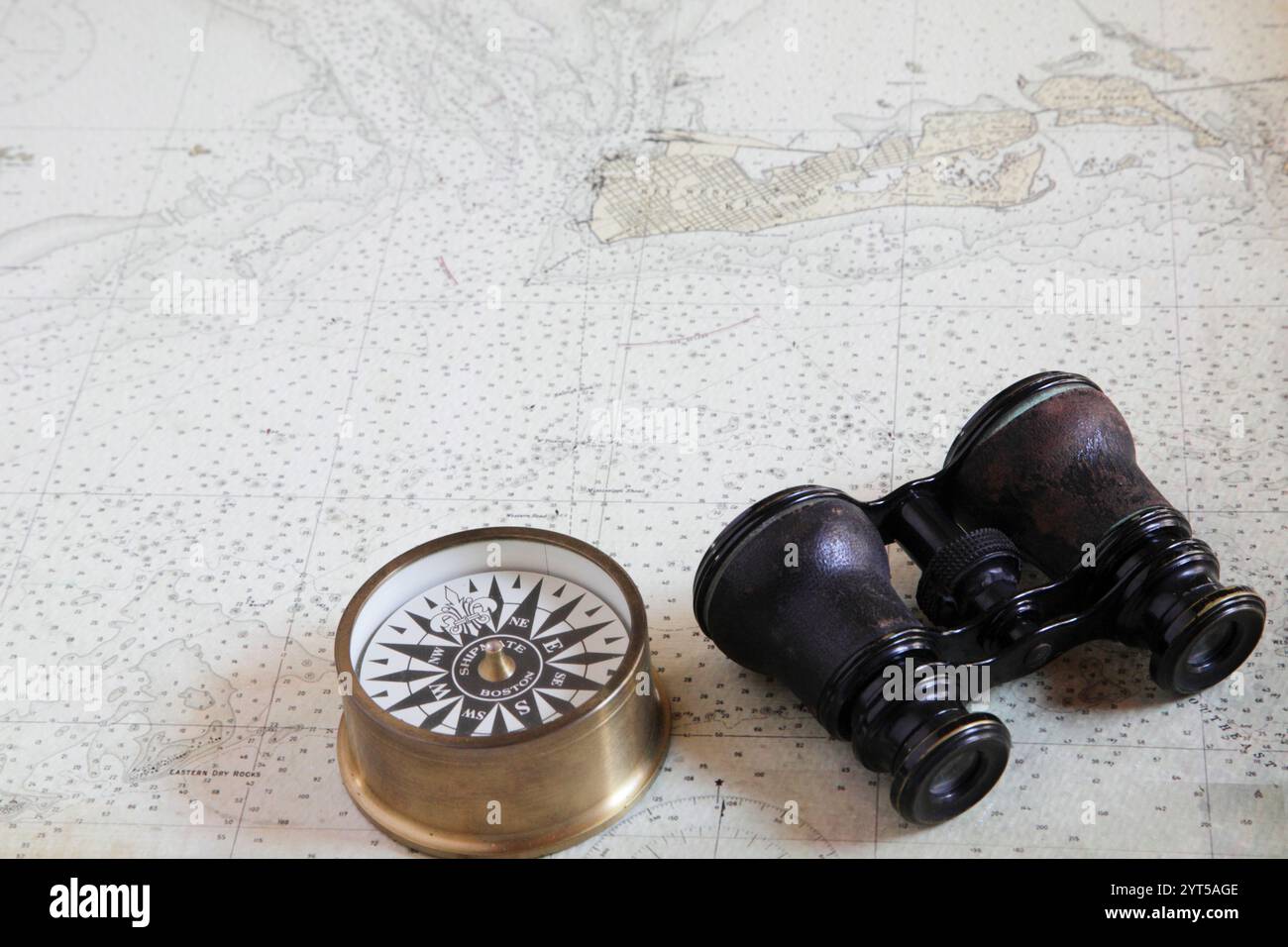 Old maps, binoculars and compasses Stock Photo - Alamy