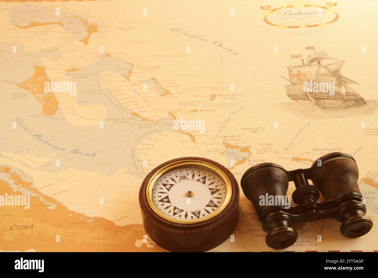 Old maps, binoculars and compasses Stock Photo - Alamy