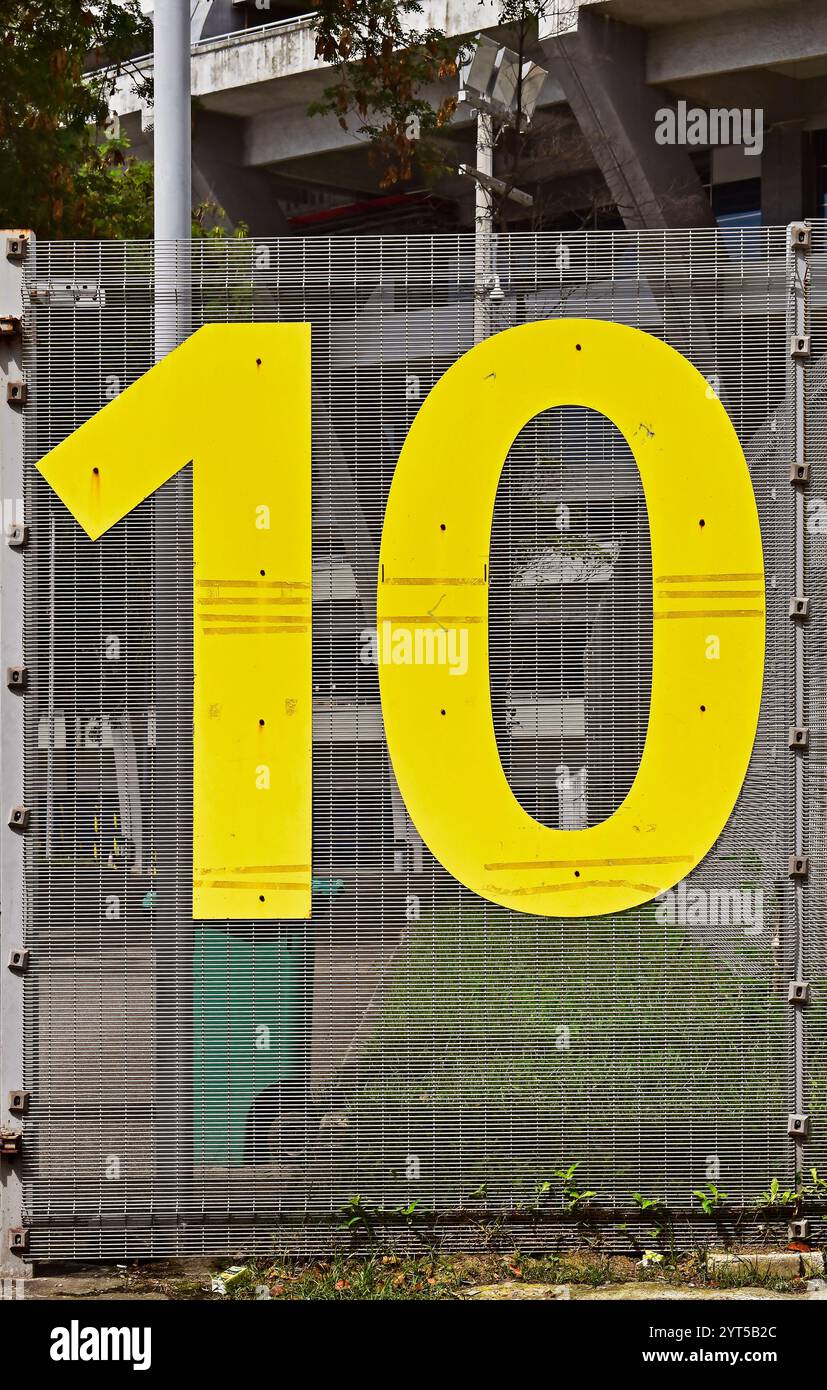 Number ten in metal on metallic grid Stock Photo - Alamy