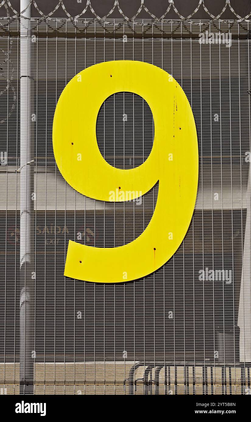 Number nine in metal on metallic grid Stock Photo - Alamy