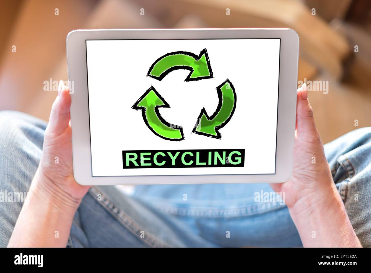Tablet screen displaying a recycling concept Stock Photo - Alamy