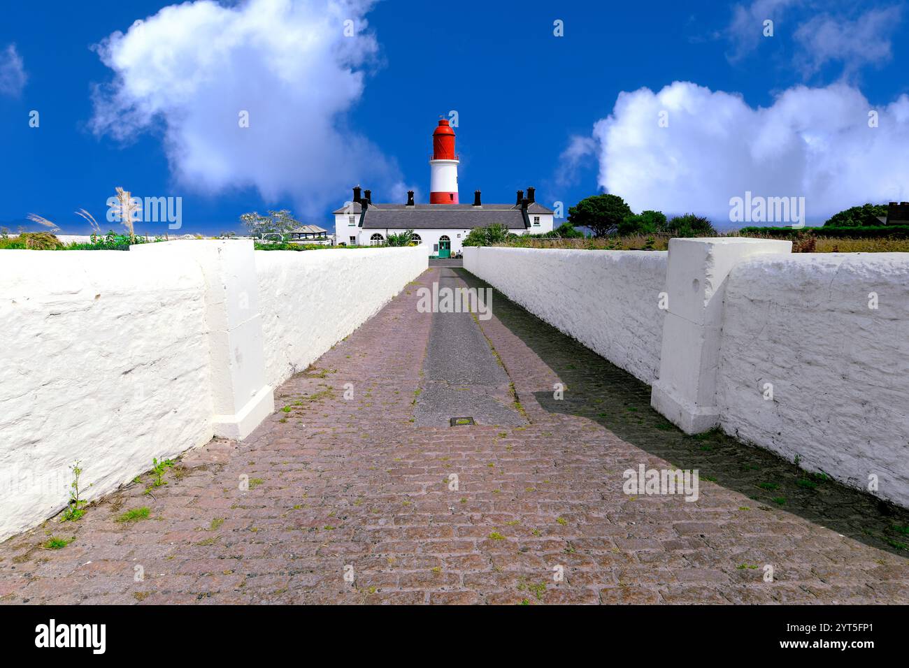 Souter Lighthouse National Trust with deep blue sky and white fluffy ...