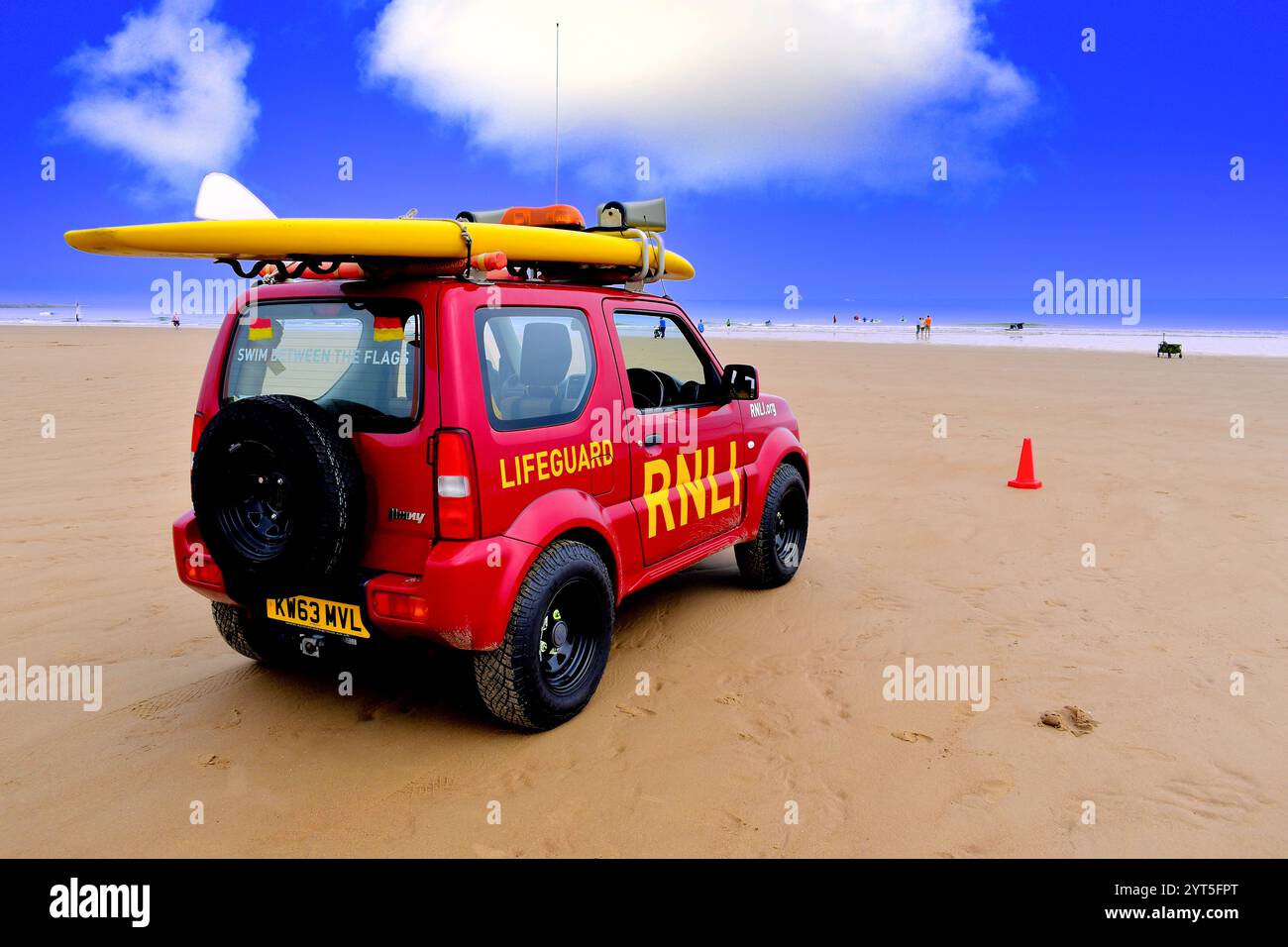 RNLI lifeguards on Tynemouth long sands beach blue sky fluffy white ...