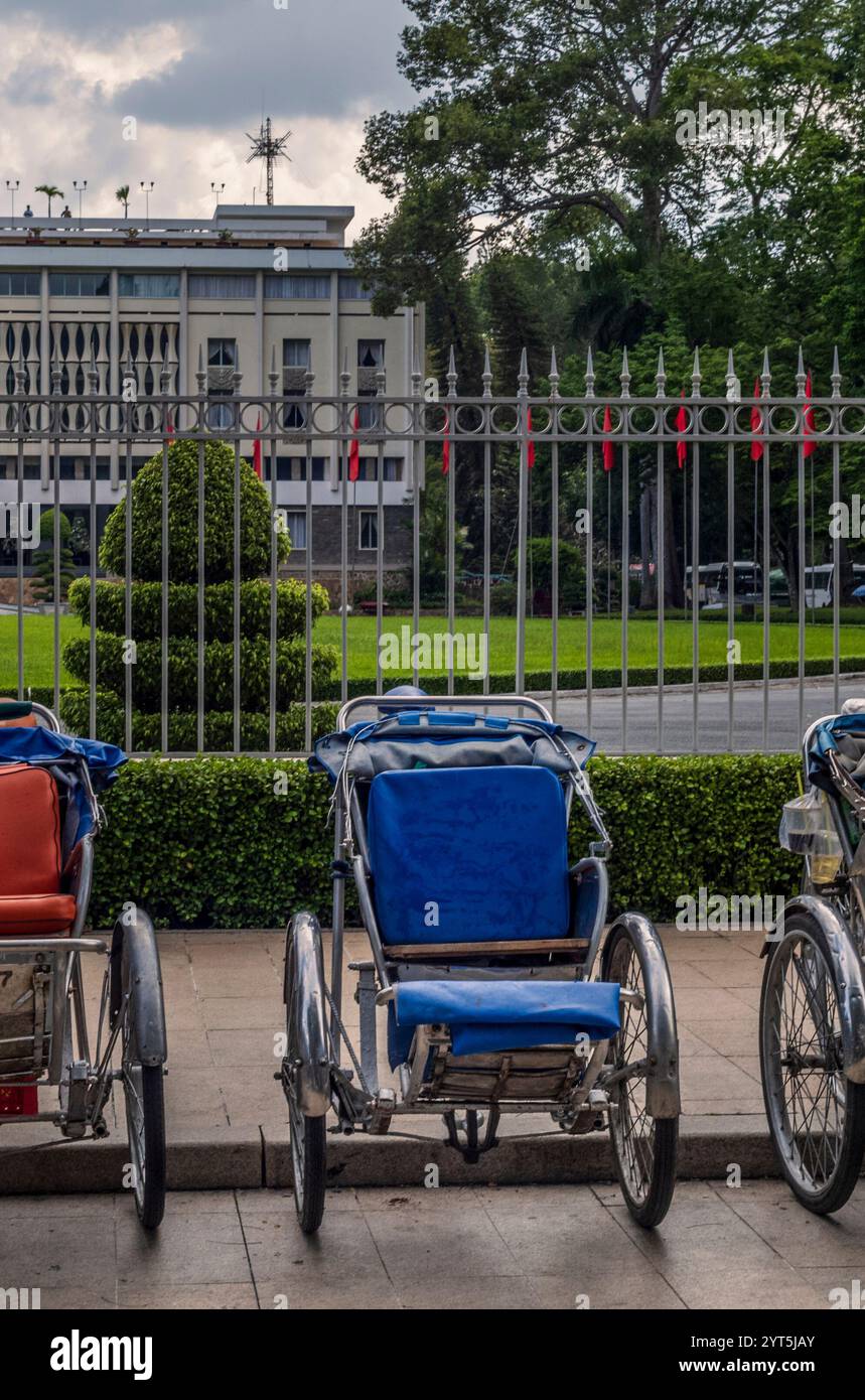 A cycle rickshaws parked on the street in Ho Chi Minh City in Vietnam ...