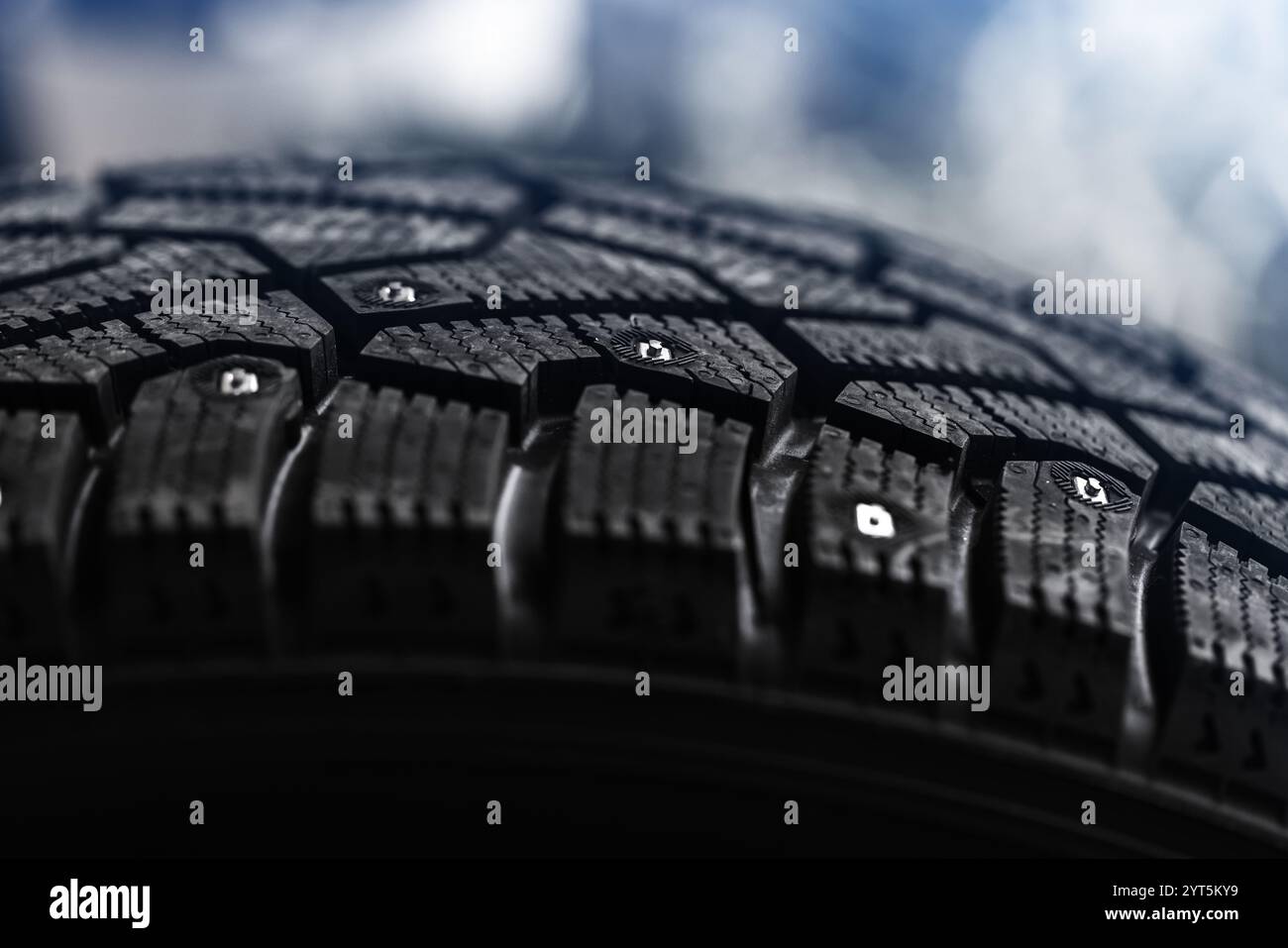 Brand new studded tire with metal studs embedded within the tread ...