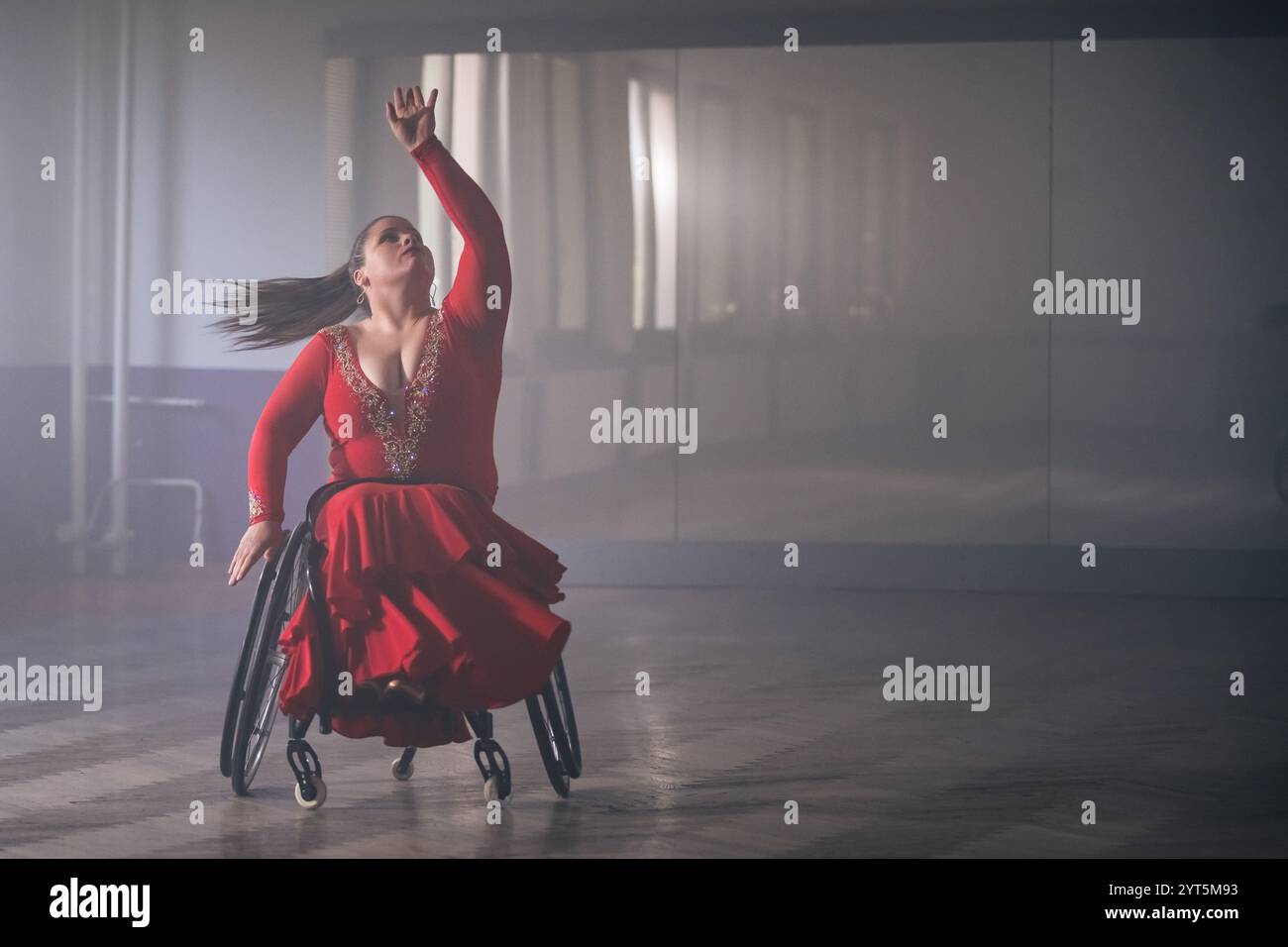 Beautiful dance in a wheelchair of a woman with disability at a dancing ...