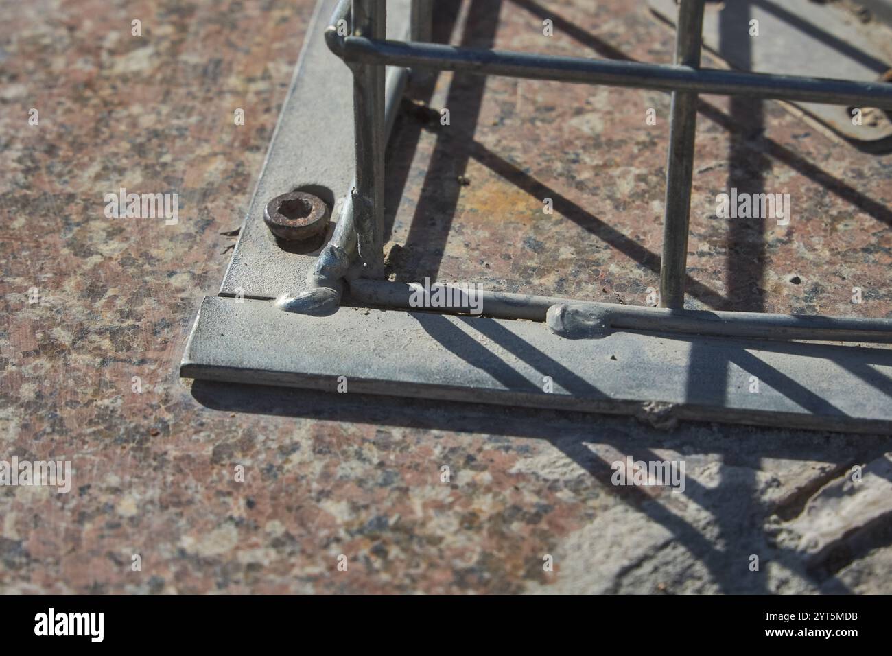 bad welding on rusted metal framework. metal structure is connected to ...
