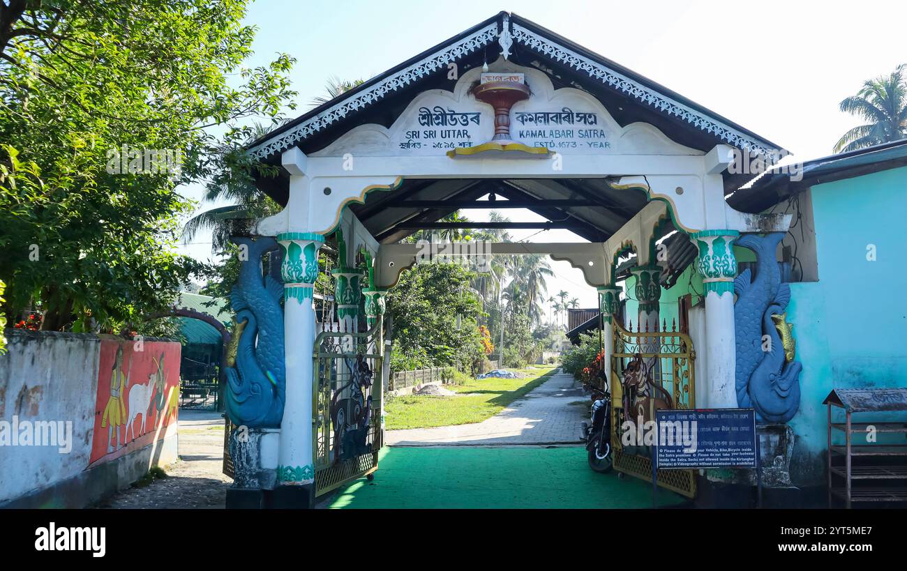 Gate leading to Uttara Kamalabari Satra, a temple dedicated to Lord Krishna, located in Majuli ...