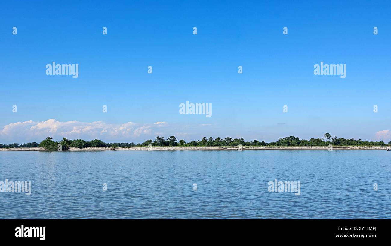 Scenic view of the mighty Brahmaputra River with a boat, Majuli, Assam, India. Majuli is largest ...
